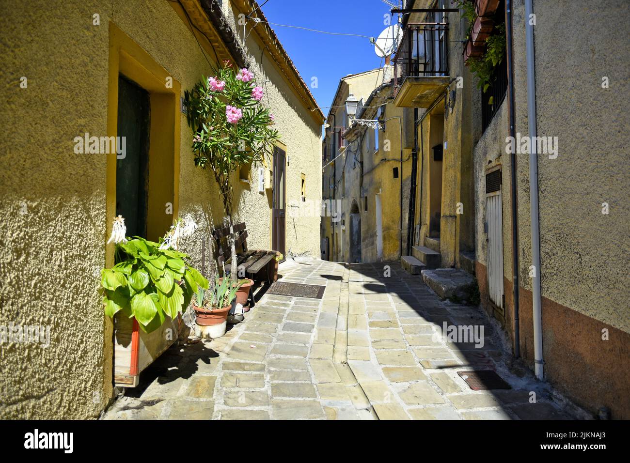 A narrow street in Calvello village in the Basilicata region of Italy ...