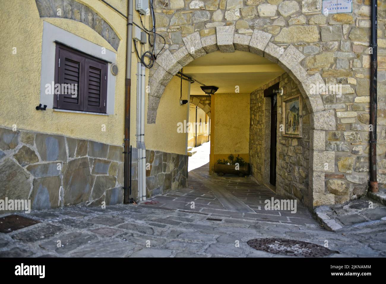 An arched pedestrian street in Calvello village in Basilicata, Italy ...