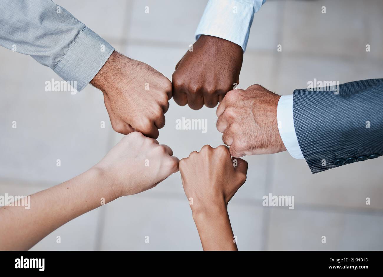 Five hands are better than one. a group of unrecognizable ...