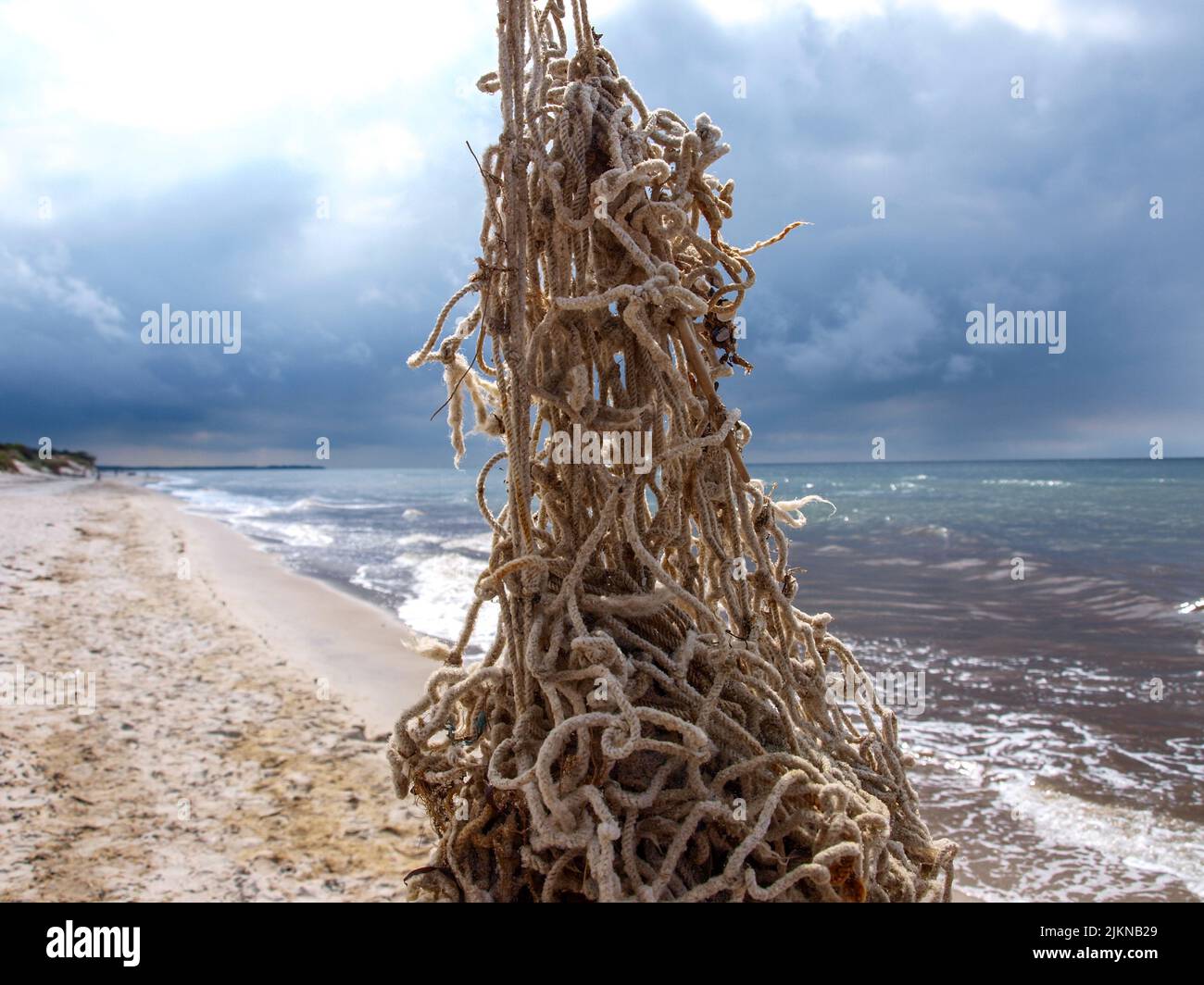 The Tangled net on the beach on a blue sky background Stock Photo - Alamy