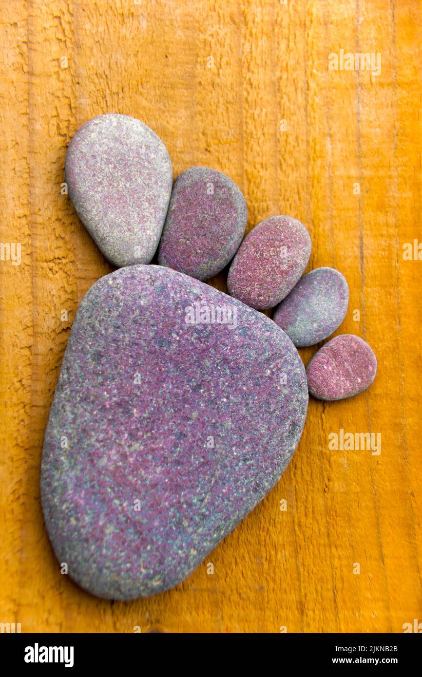 A foot shape with toes made of stones Stock Photo - Alamy