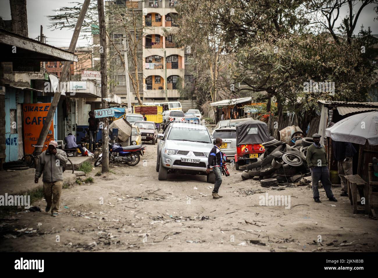 The poor district of Nairobi with buildings and cars. Kenya Stock Photo ...