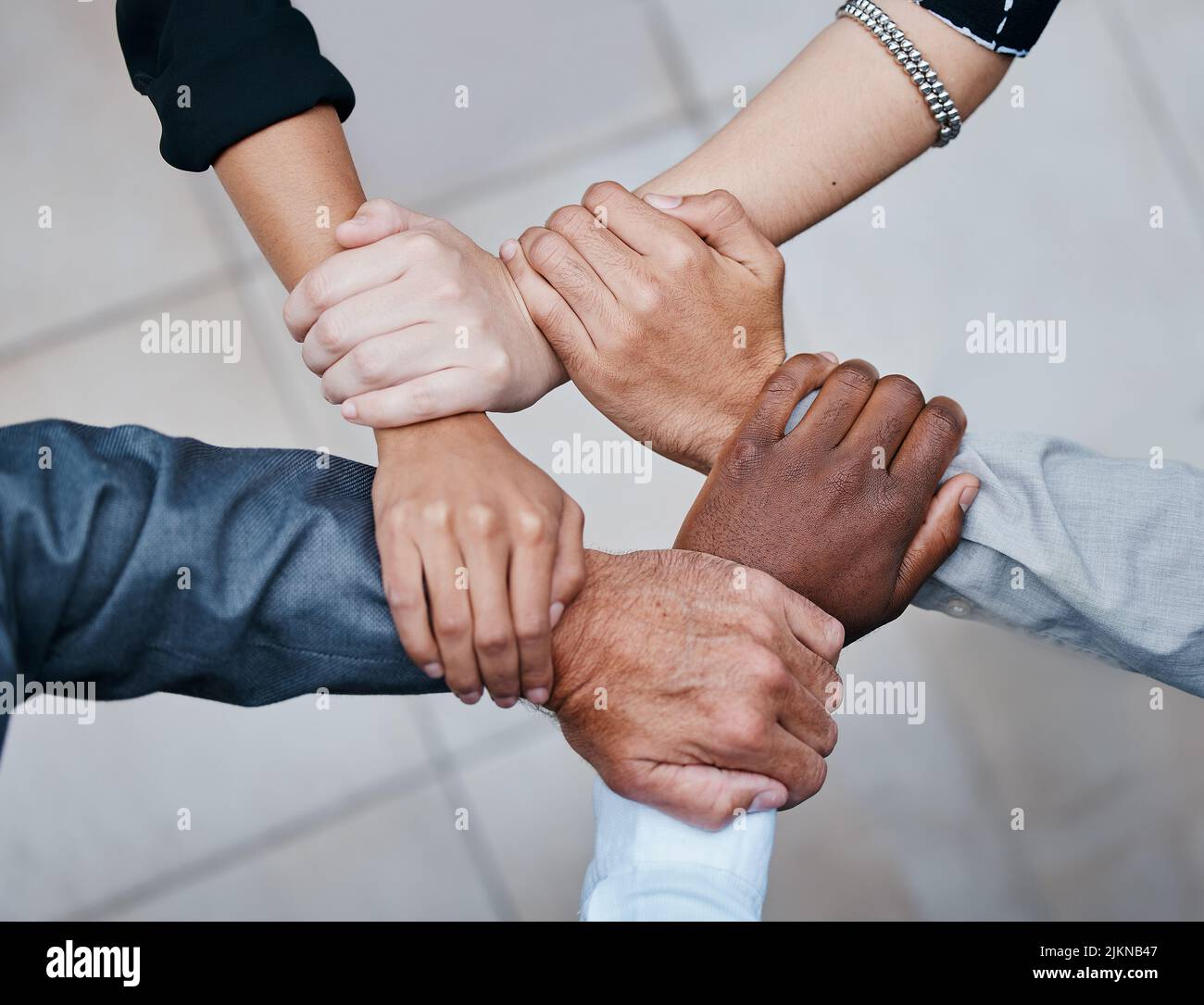 A diverse team makes for a better team. a group of unrecognizable ...