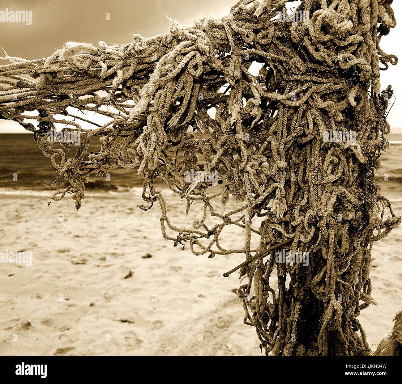 The Cashel braided rope and the sand Stock Photo - Alamy