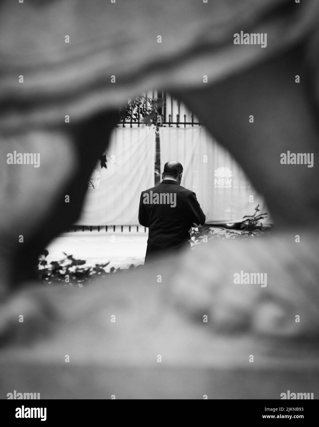 Suit from behind man Black and White Stock Photos & Images - Alamy
