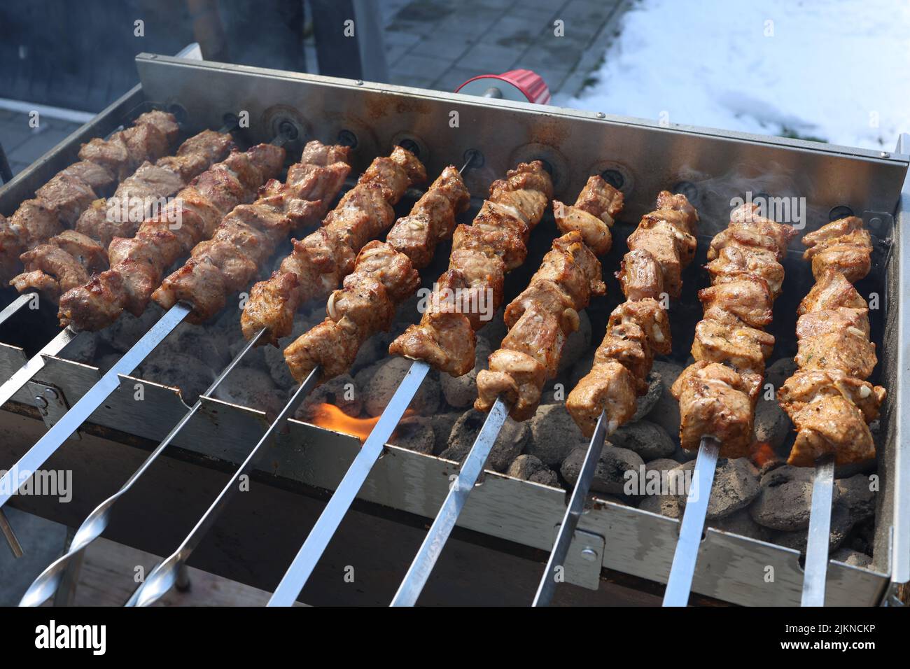 Roasted meat cooked at barbecue with smoke Stock Photo - Alamy