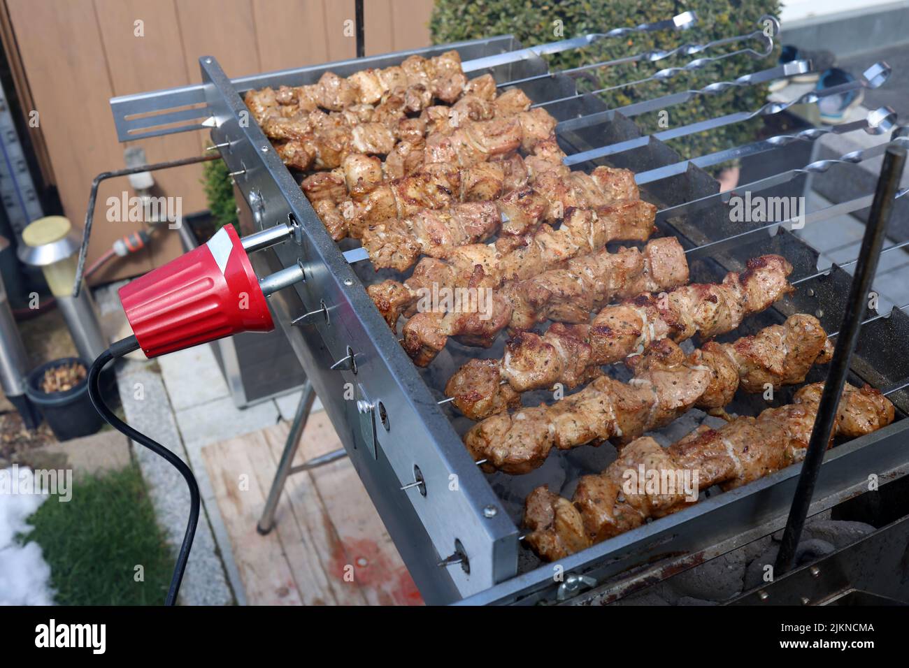 Roasted meat cooked at barbecue with smoke Stock Photo - Alamy