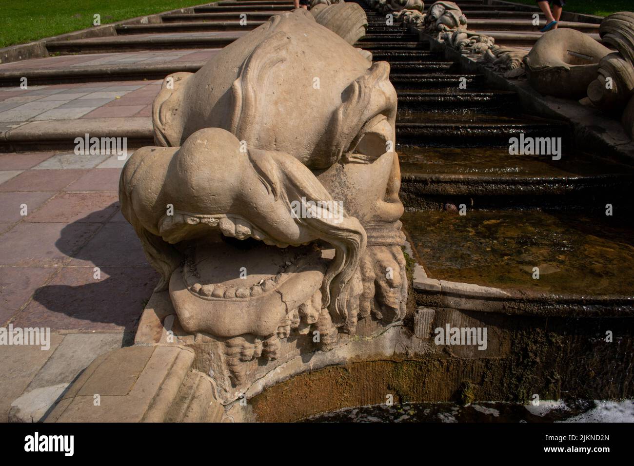 A selective of a dragon sculpture on a water pond in a park Stock Photo ...