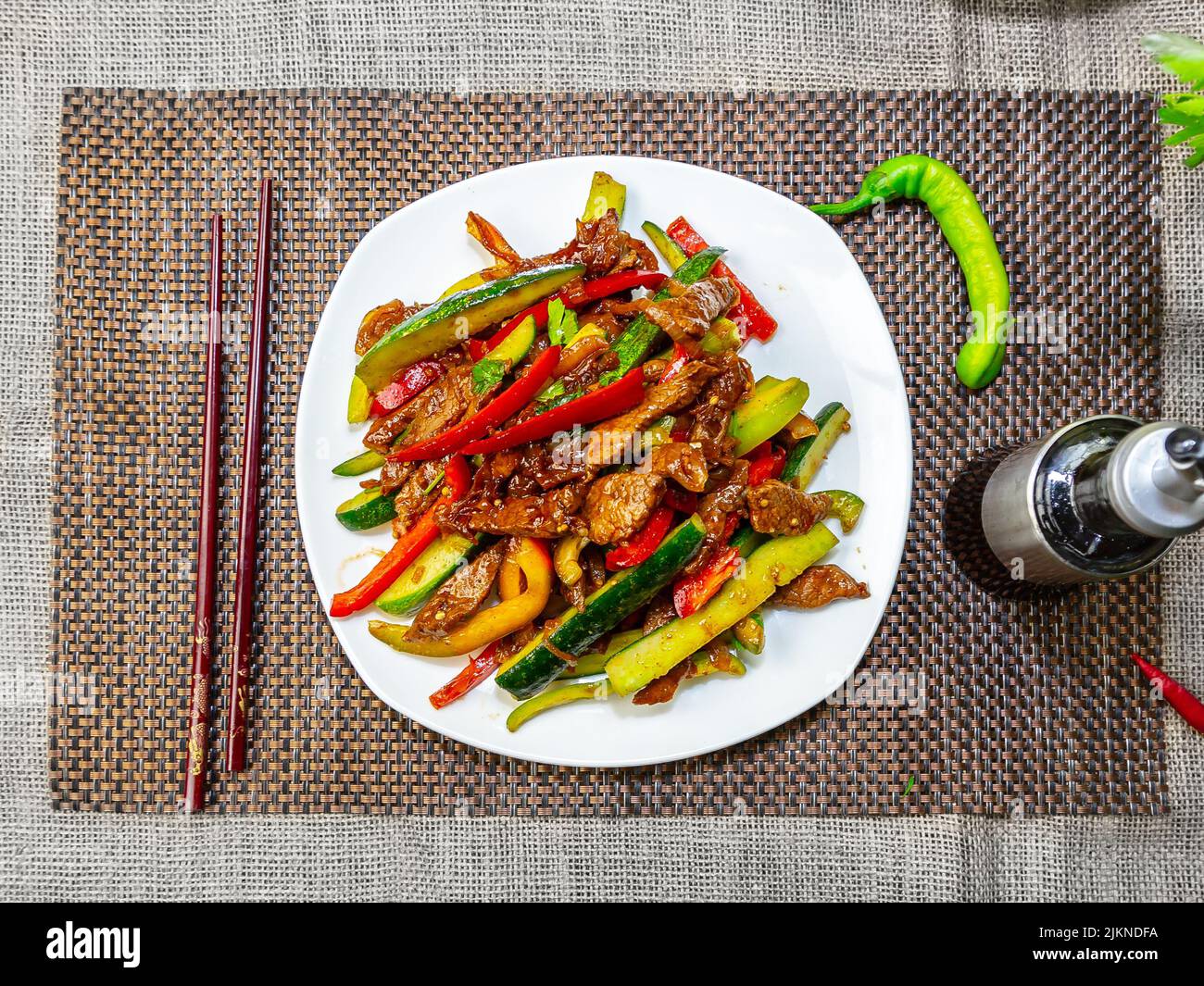 A top view of a dish with beef slices and different vegetables Stock ...