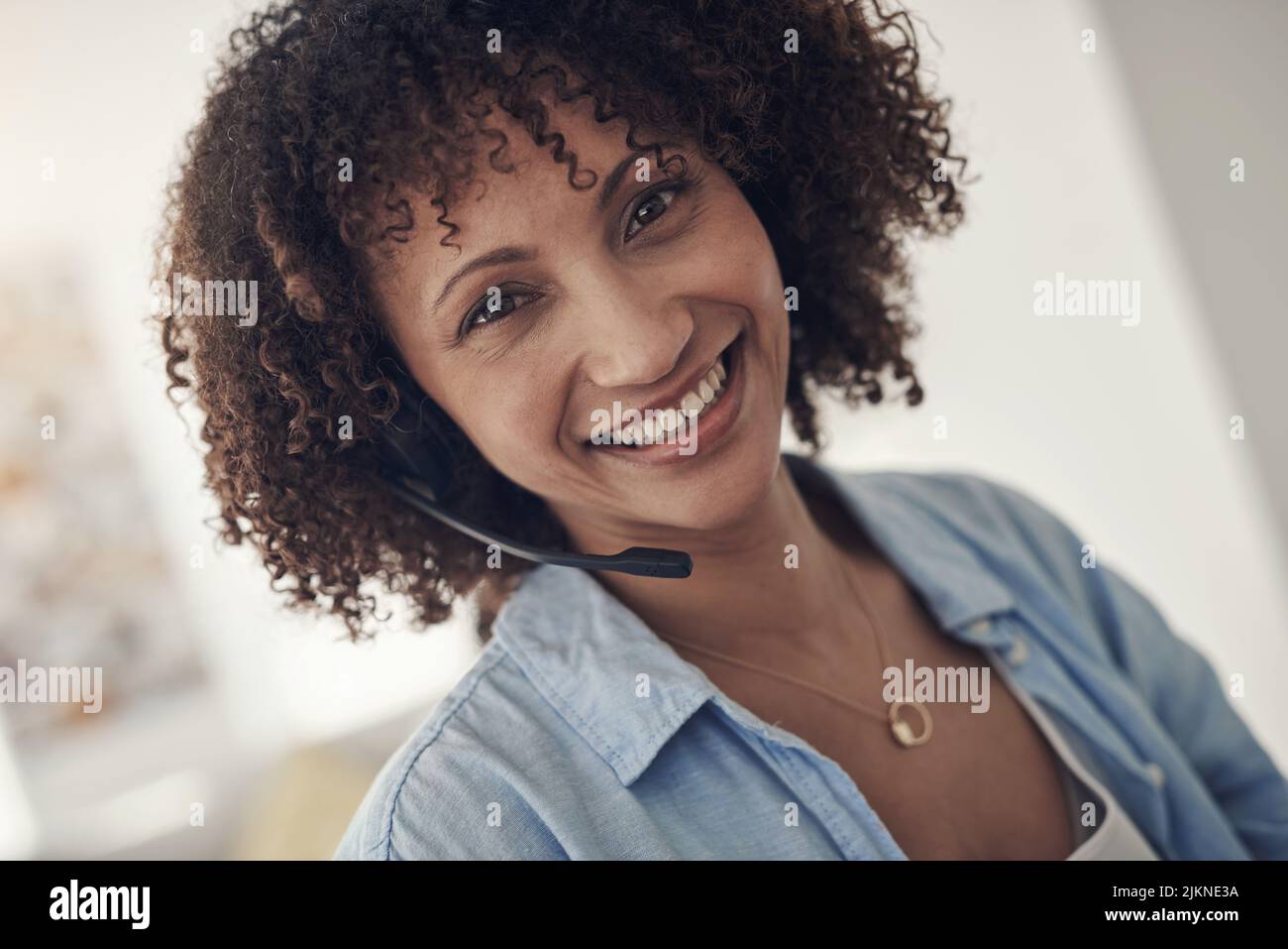 Working from home is the future. an attractive young sitting alone at ...