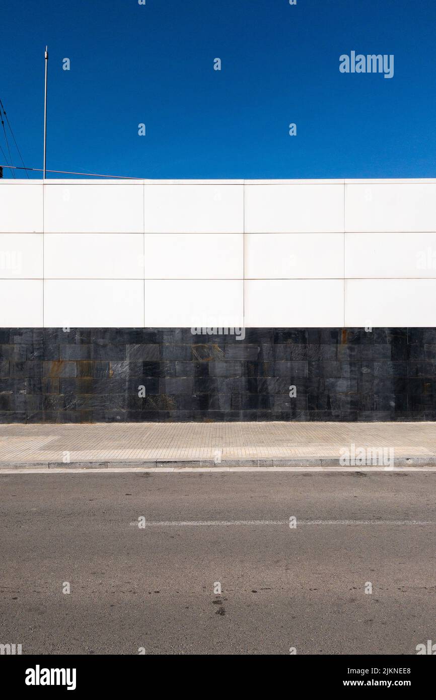 A vertical shot of a road and a wall with different layers Stock Photo ...