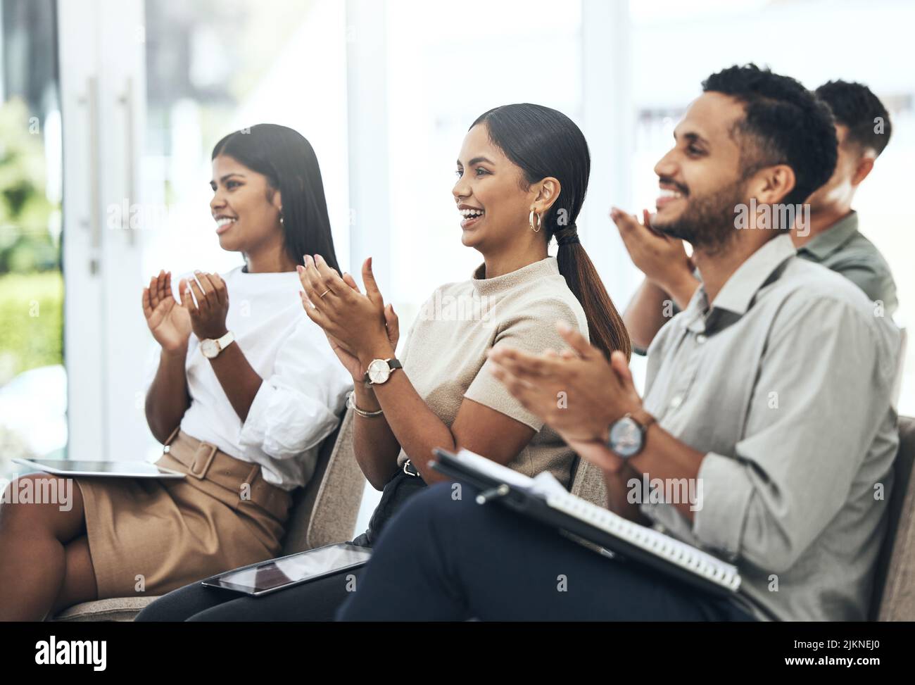 That deserves a round of applause. a group of people clapping and ...