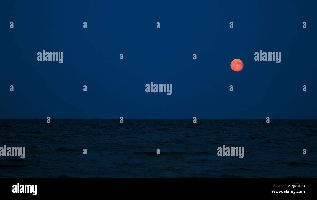 Red moon sea hi-res stock photography and images - Alamy
