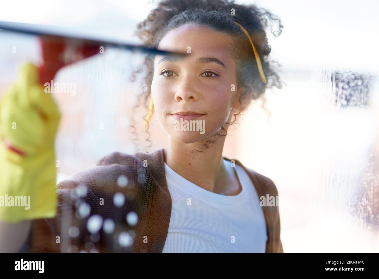 Woman washing windows hi-res stock photography and images - Alamy