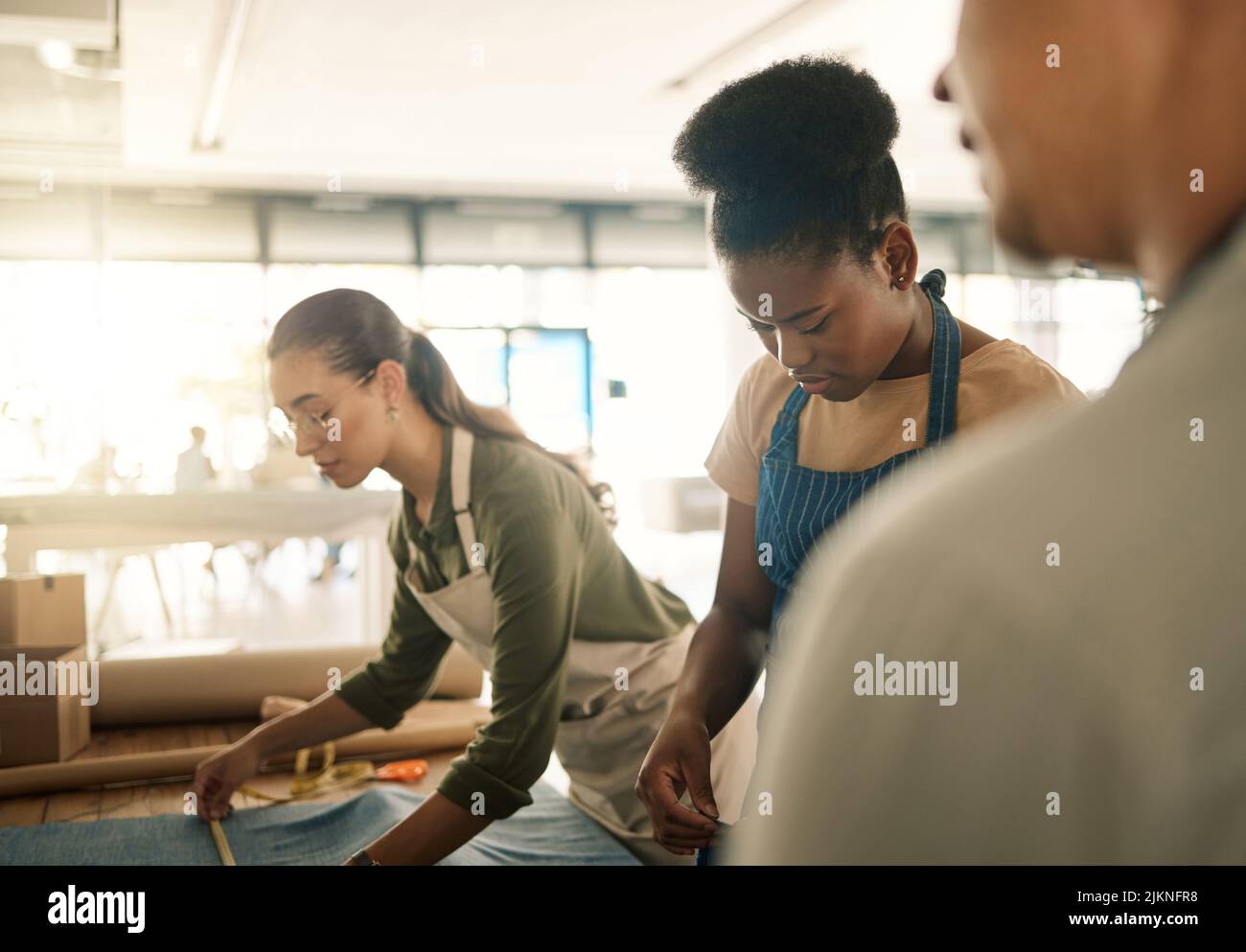 Design, style and fashion group busy working with designer fabric ...