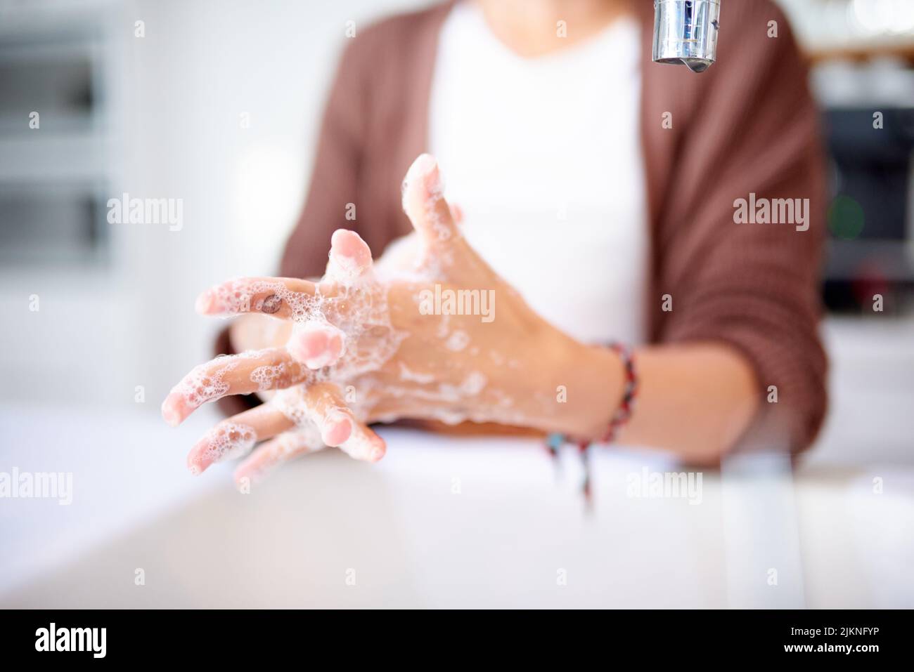 Dont forget to get in between those fingers. an unrecognizable woman ...