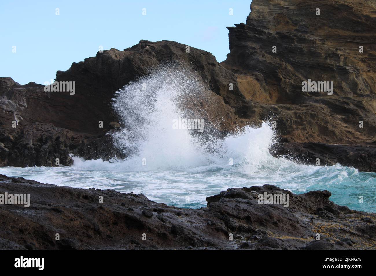 A body of wavy water near the rocky shore in the sunlight Stock Photo ...