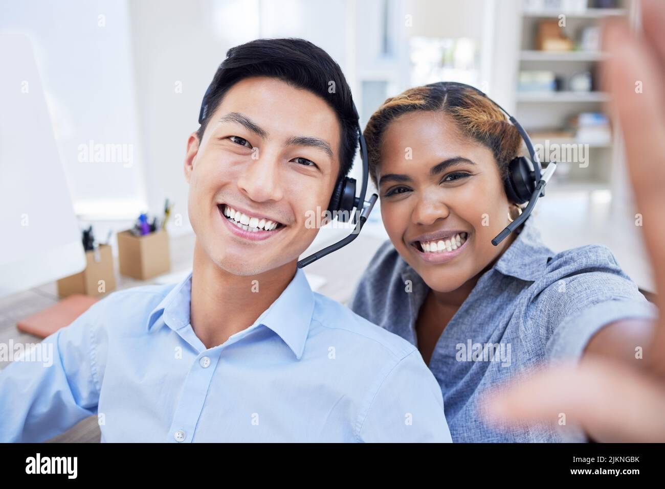 Selfie of diverse call center agents or colleagues having fun together ...