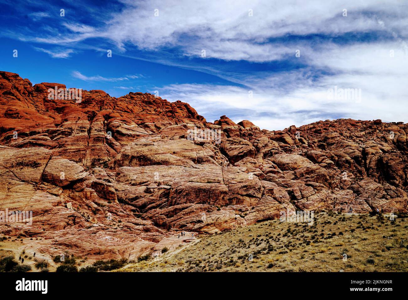 A breathtaking view of the Red Rock Canyon Overlook on a blue cloudy ...