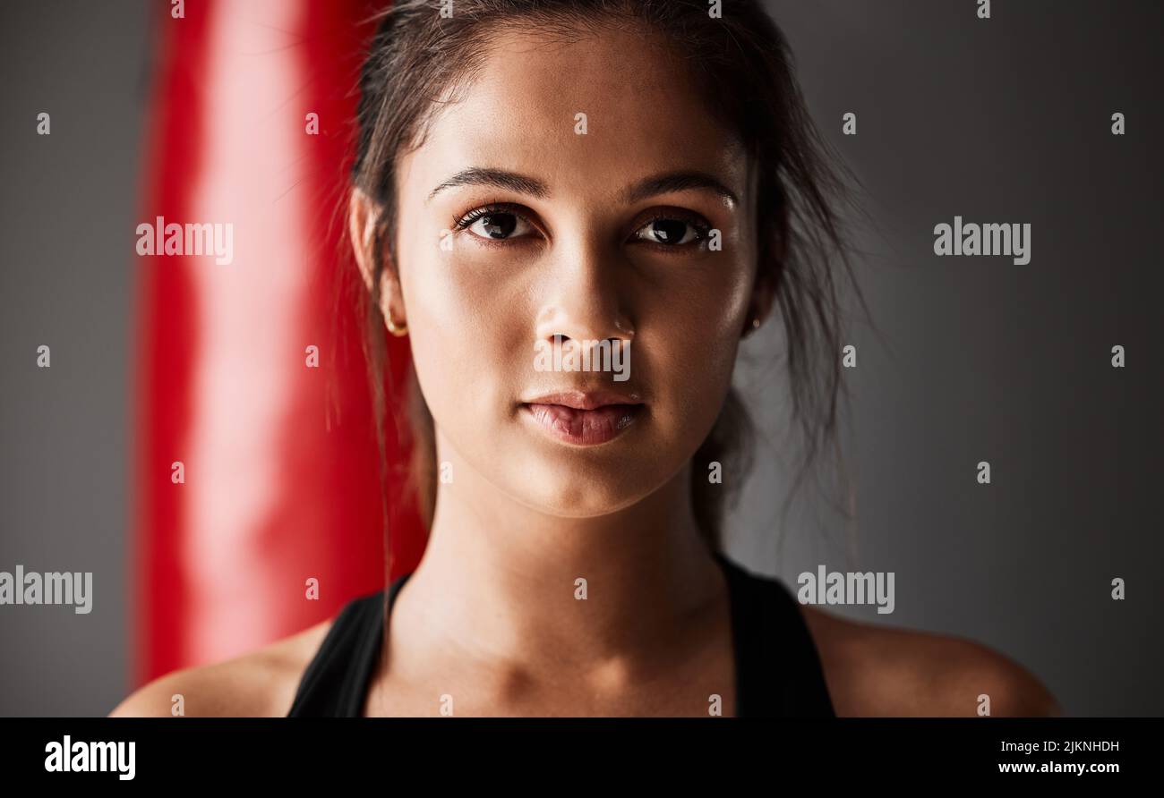 Fit anf confident. Cropped portrait of an attractive young female boxer ...