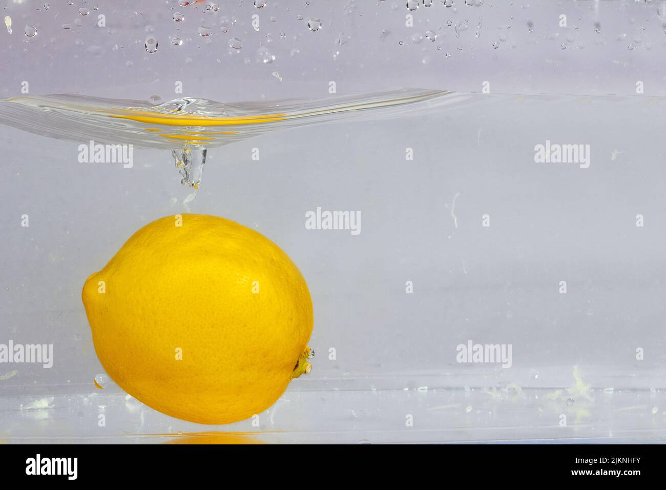 Lemon water splash, isolated on a white background Stock Photo - Alamy