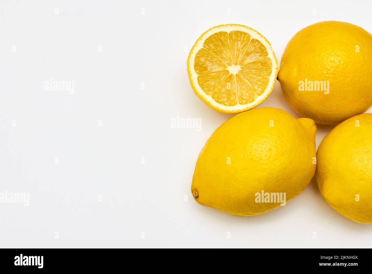 Whole and sliced lemon slices on white background Stock Photo - Alamy