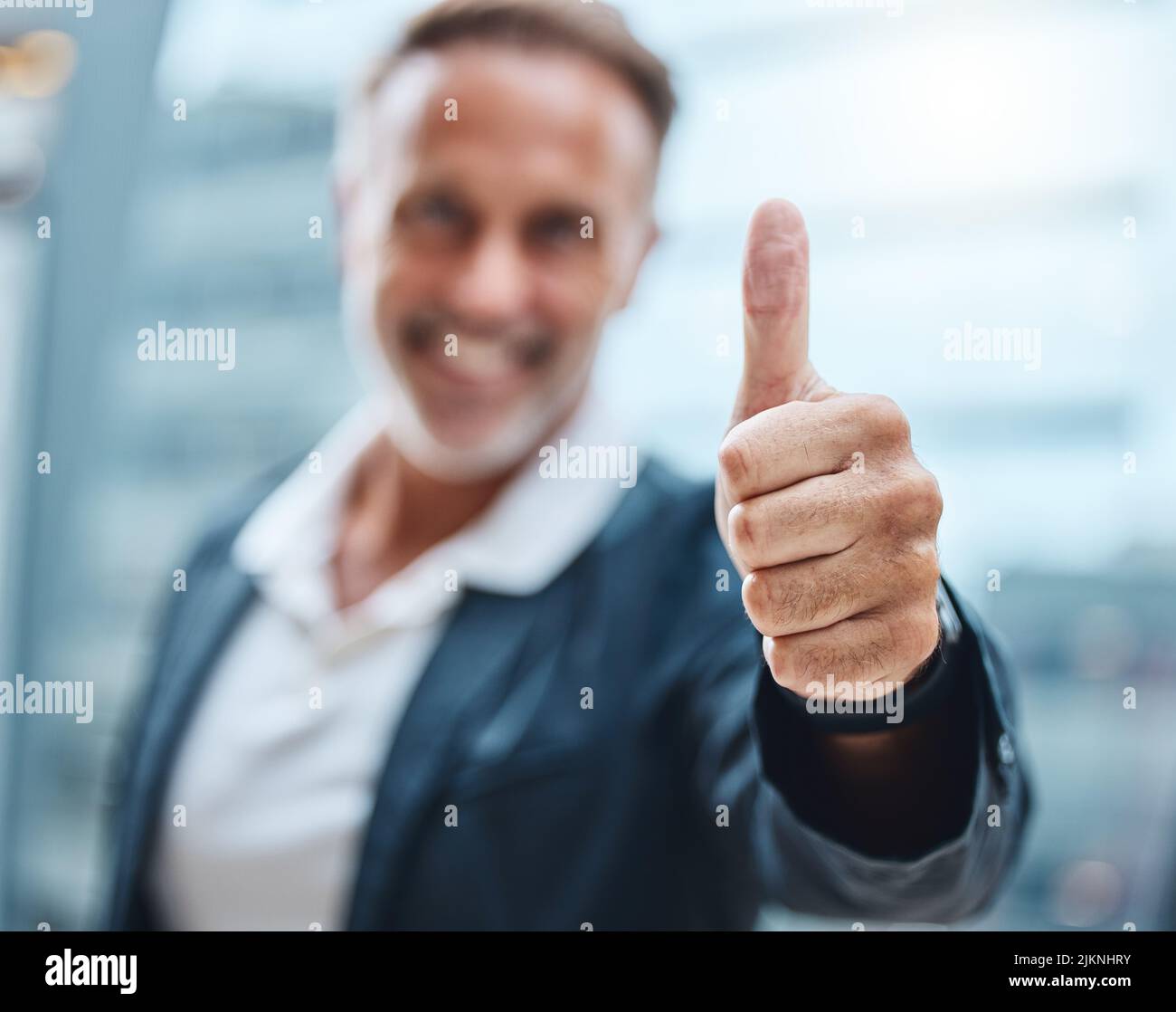 Youre getting better everyday. a mature businessman showing thumbs up ...