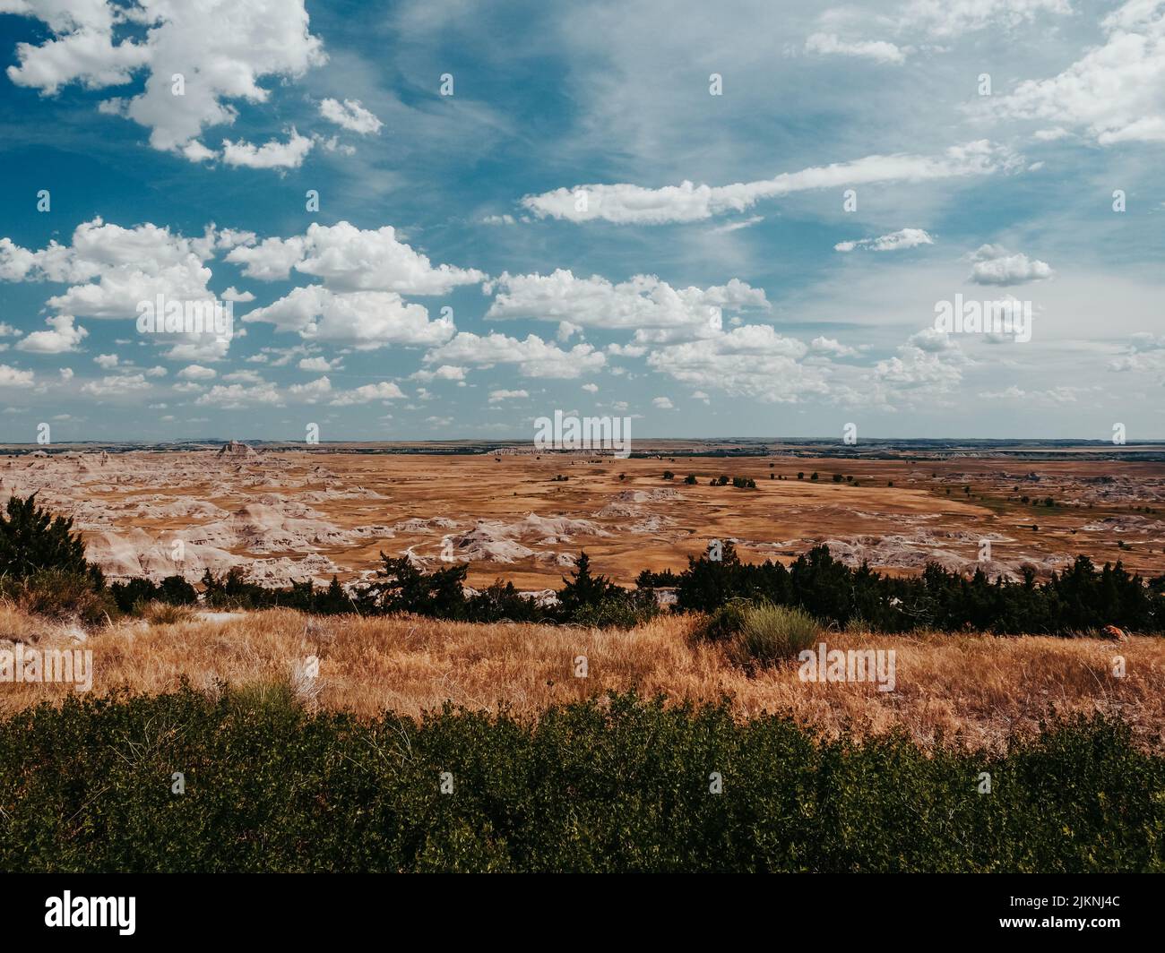 A scenic landscape of the steppe under the beautiful clouds Stock Photo ...