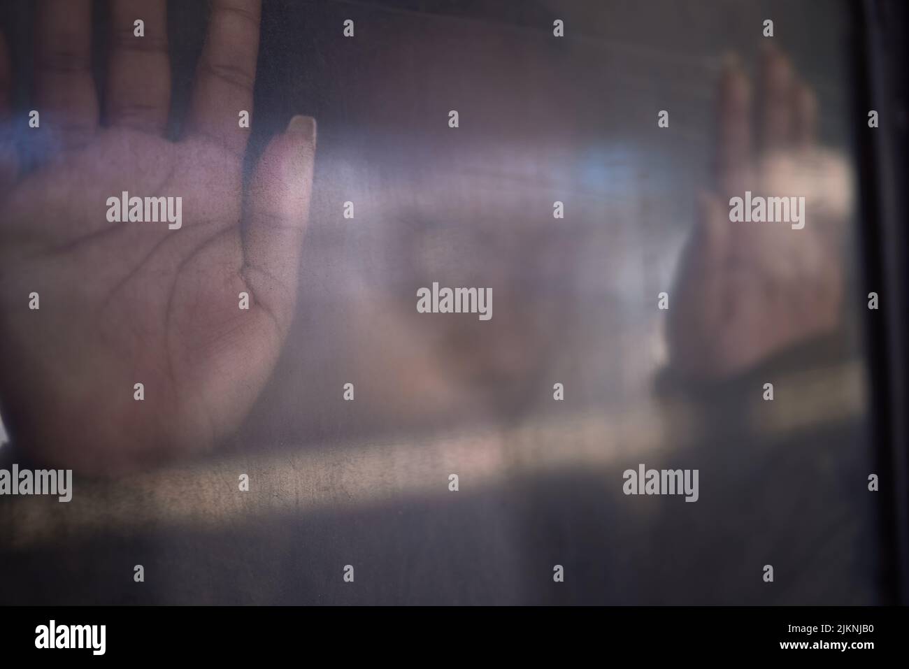 Depression got her feeling trapped. an unrecognizable womans hands ...