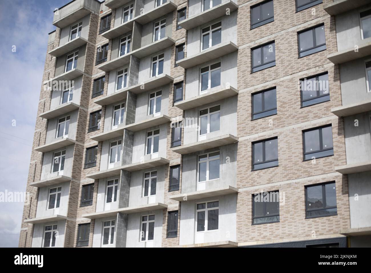 Building in city. Architecture details. Lots of windows in house. Urban ...