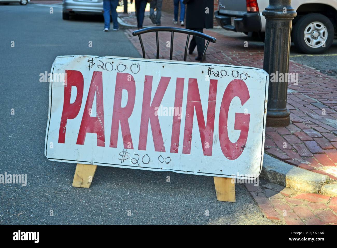 red parking sign with price on asphalt, modern transportation diversity ...