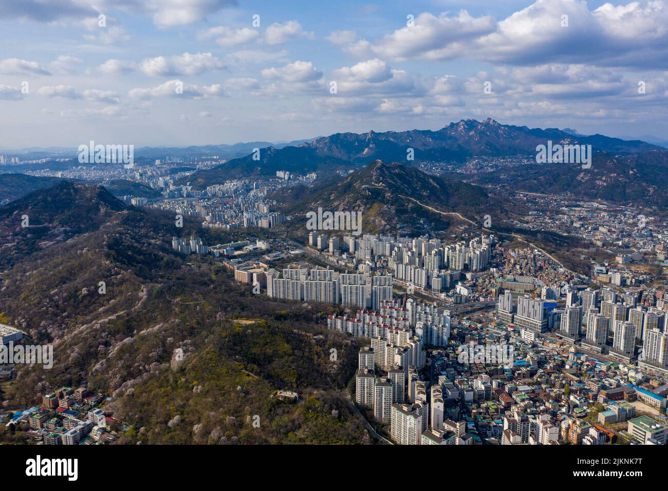 An aerial cityscape of Seoul surrounded by buildings in background of ...