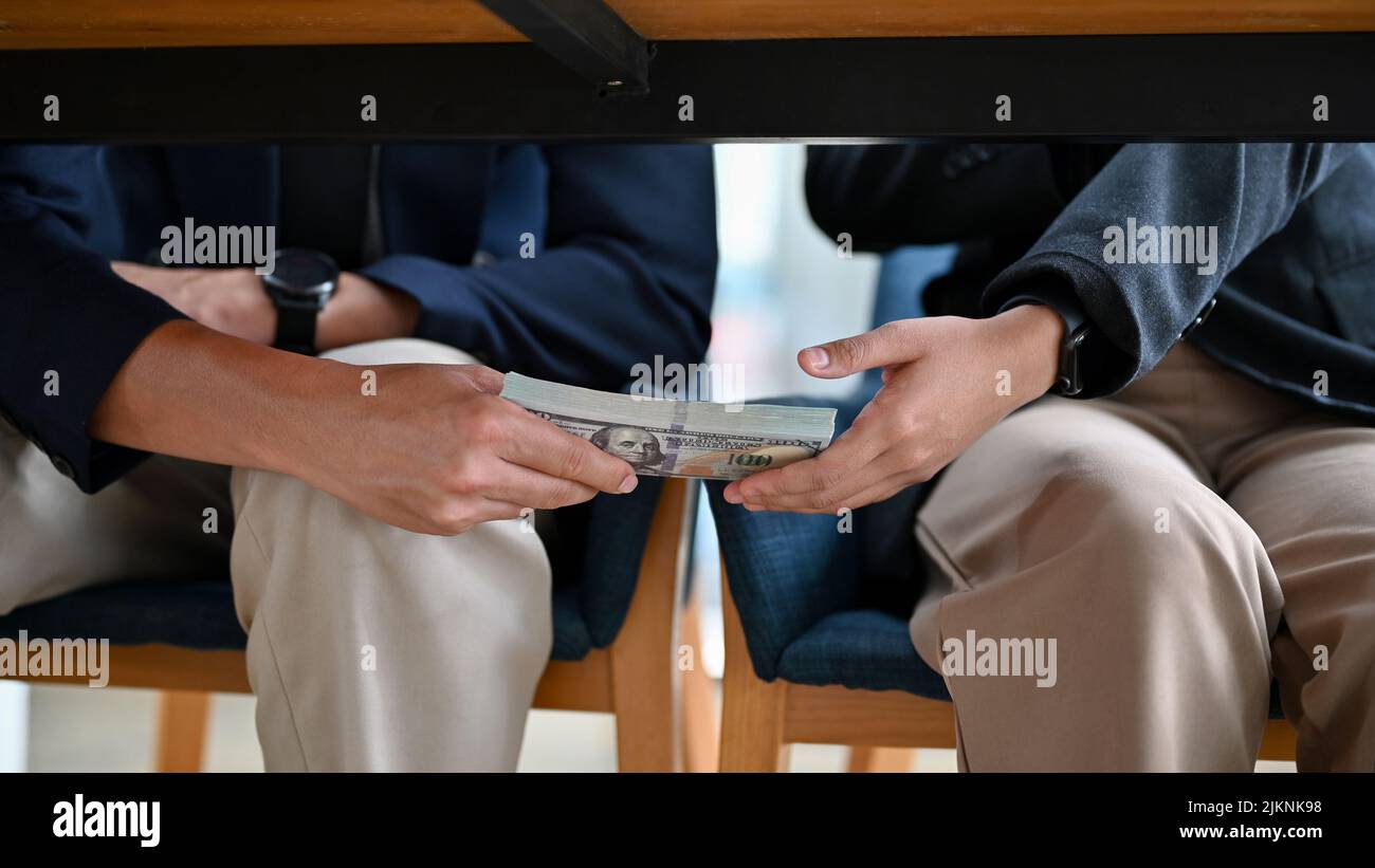 Money under the table hi-res stock photography and images - Alamy