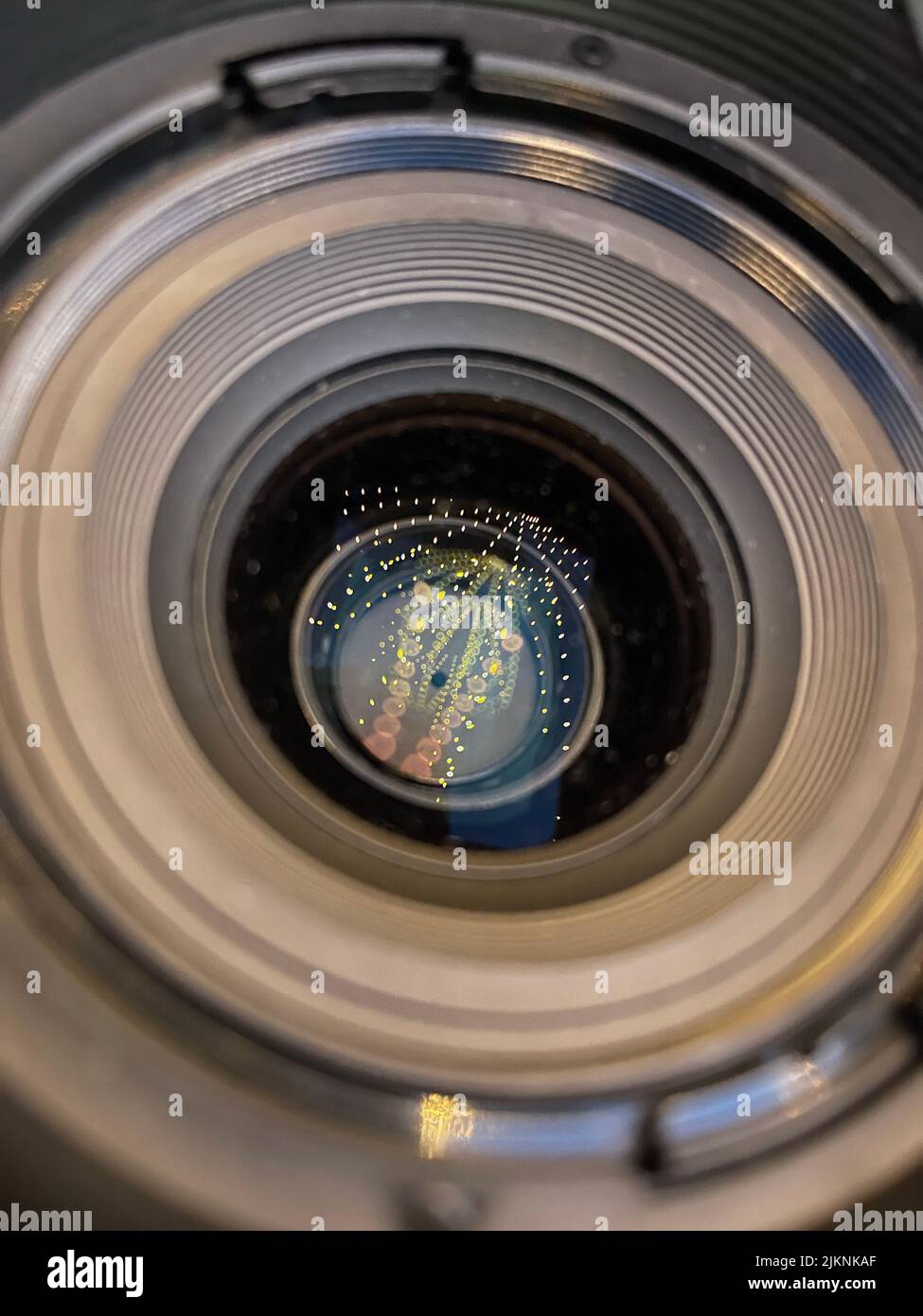 A vertical shot of lens with a reflection of lights Stock Photo - Alamy