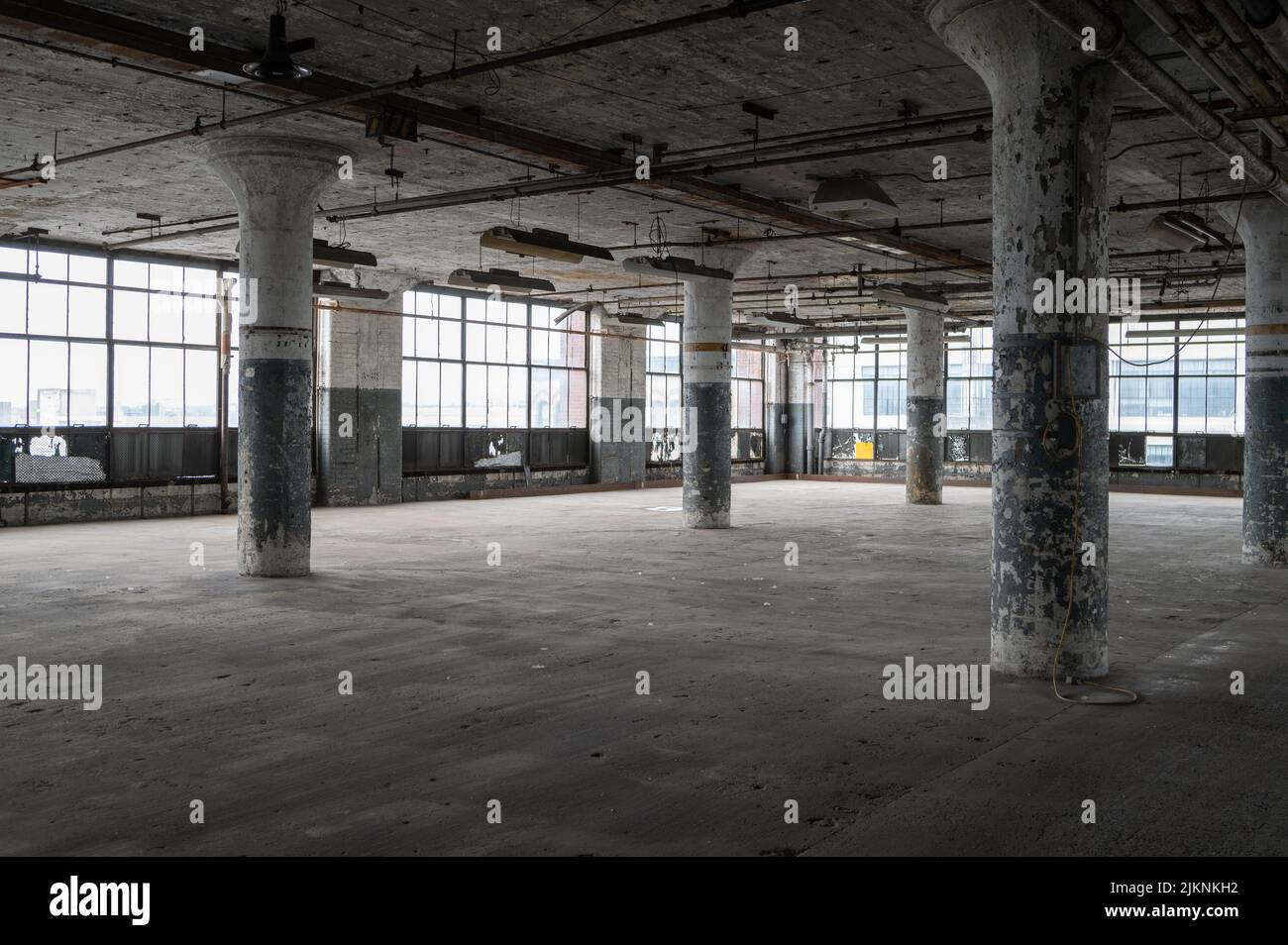 The interior of a large industrial space with columns Stock Photo - Alamy