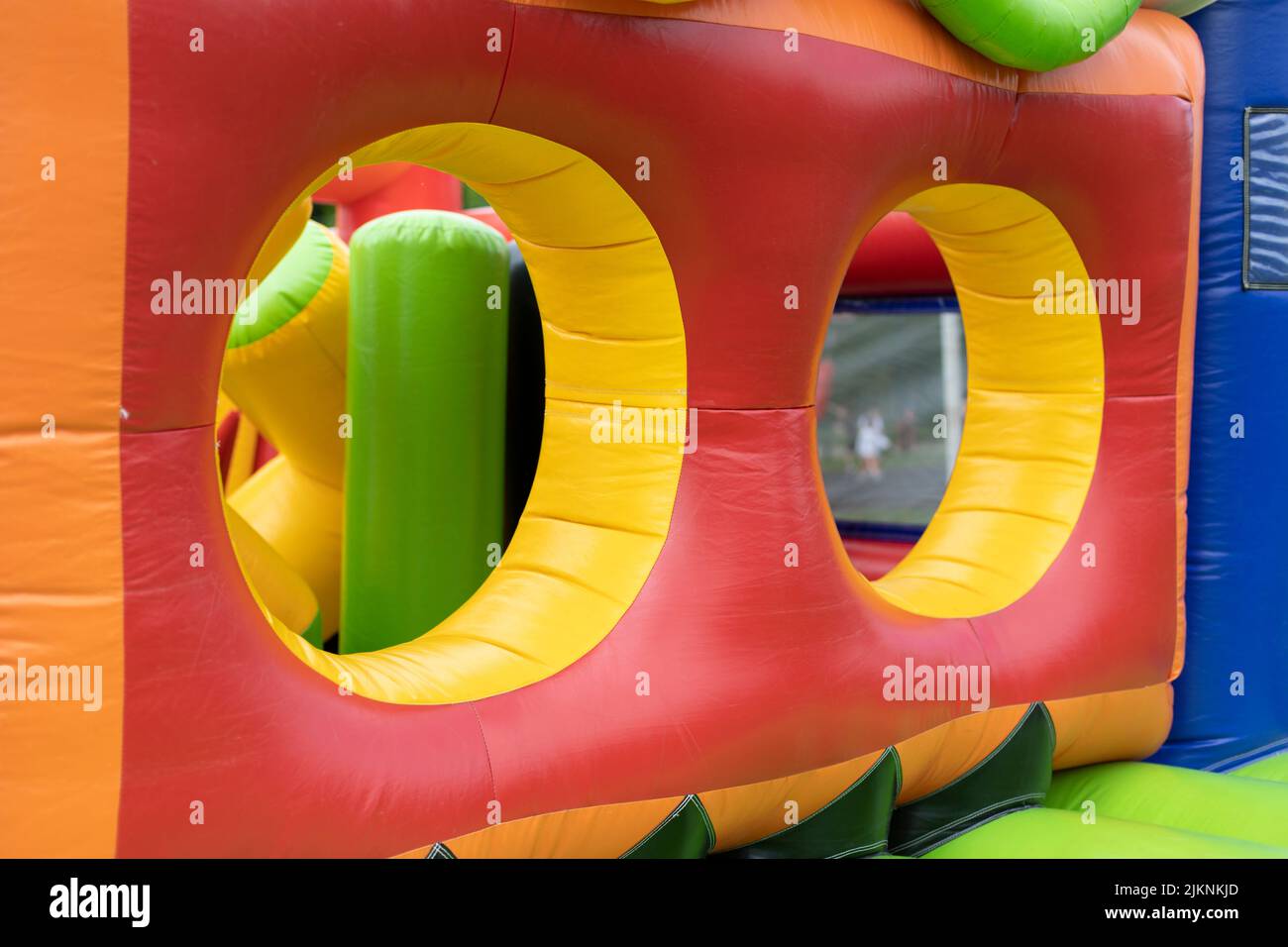 Inflatable construction in amusement park. Obstacle course for children ...