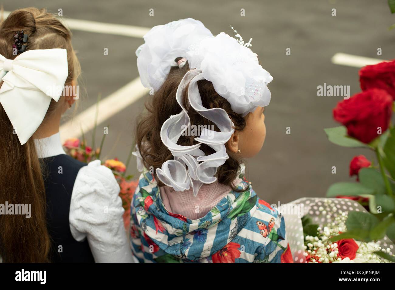 Student with flowers. Schoolgirl at party at school. Girl in Russia on ...