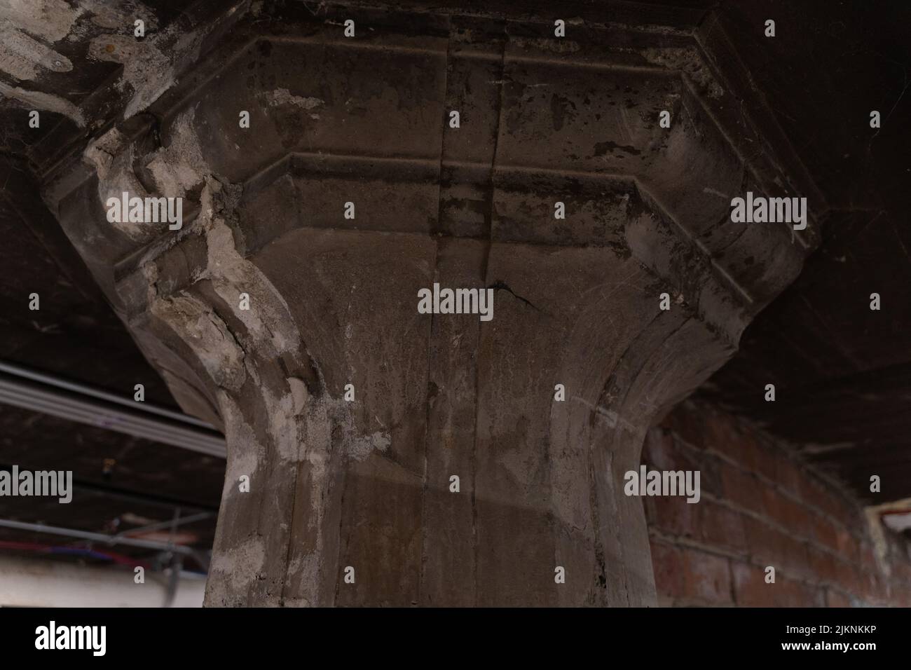 A detail of an ancient building with a stone column Stock Photo - Alamy