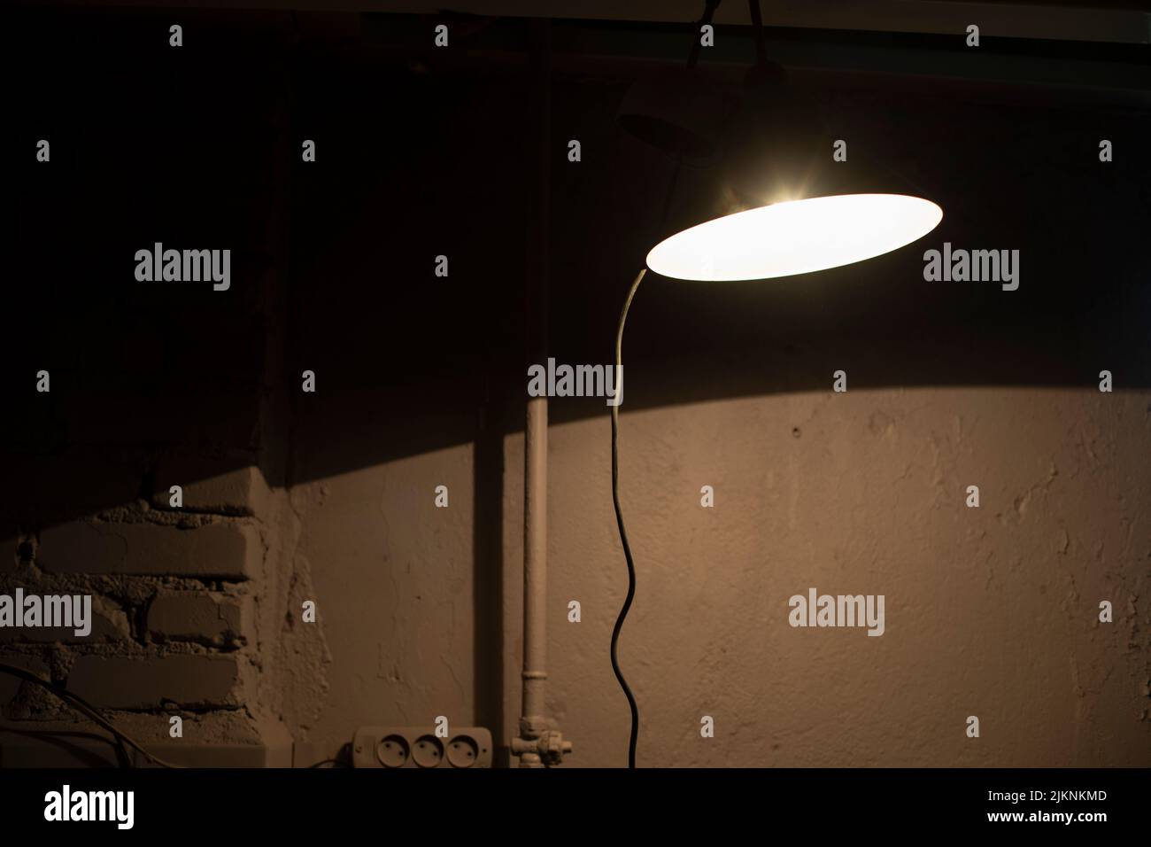 Lamp in room. Dim light indoors. Utility room. One lamp Stock Photo - Alamy