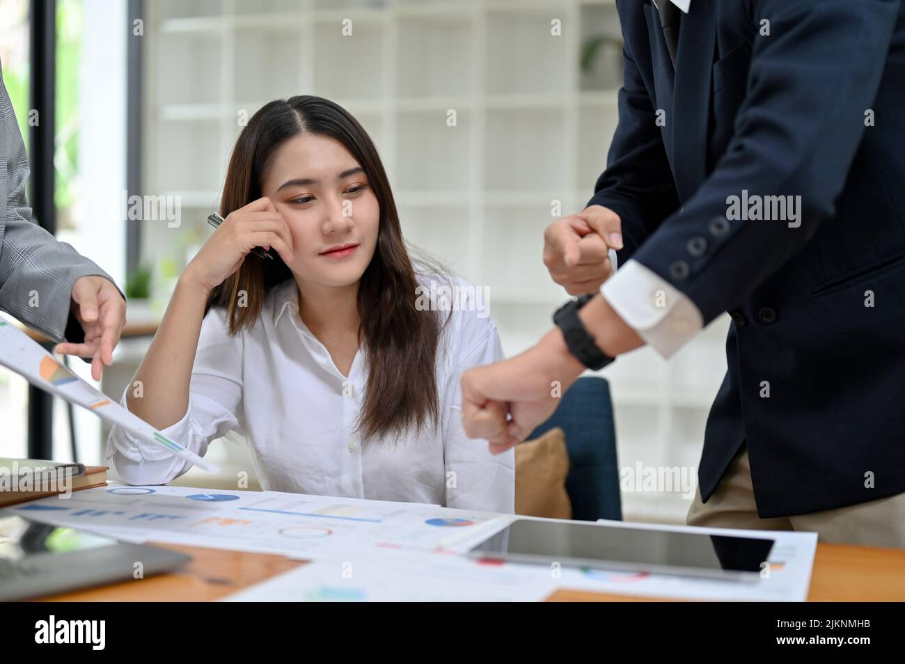 Pretty young Asian female business employee working and planning the ...