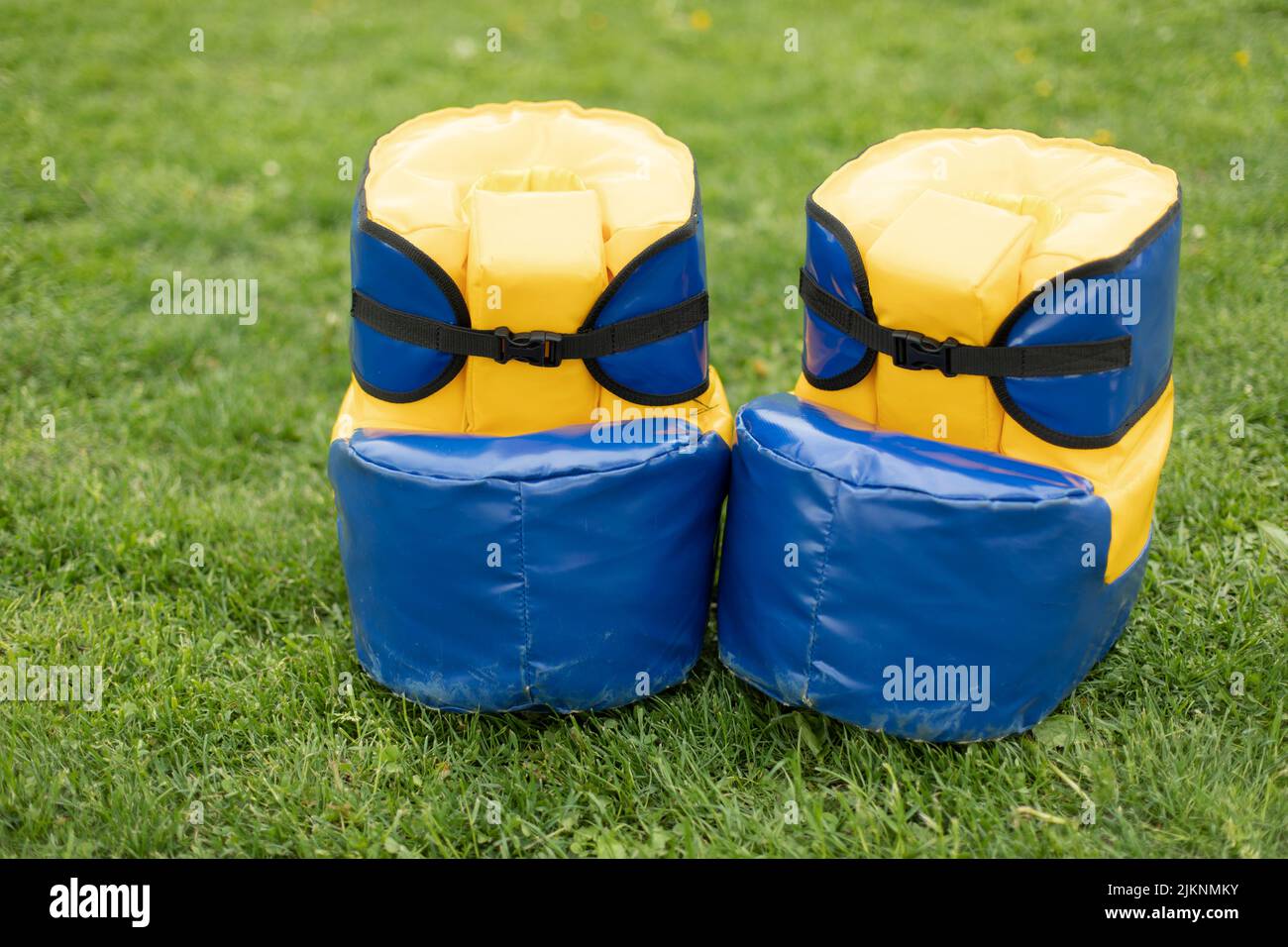 Funny shoes of blue color. Equipment for playing outdoors. It's ...