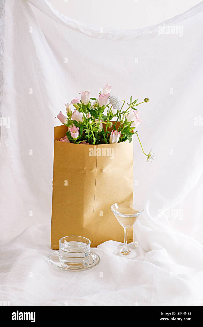 A vertical shot of a bouquet of eustomas on the white background Stock ...