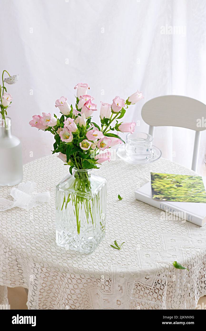 A vertical shot of a bouquet of eustomas in the vase Stock Photo - Alamy