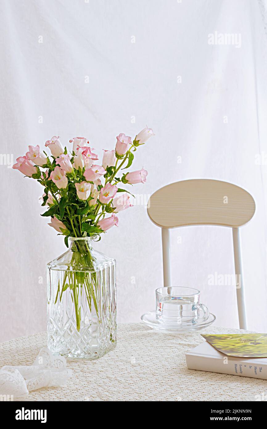 A vertical shot of a bouquet of eustomas in the vase Stock Photo - Alamy