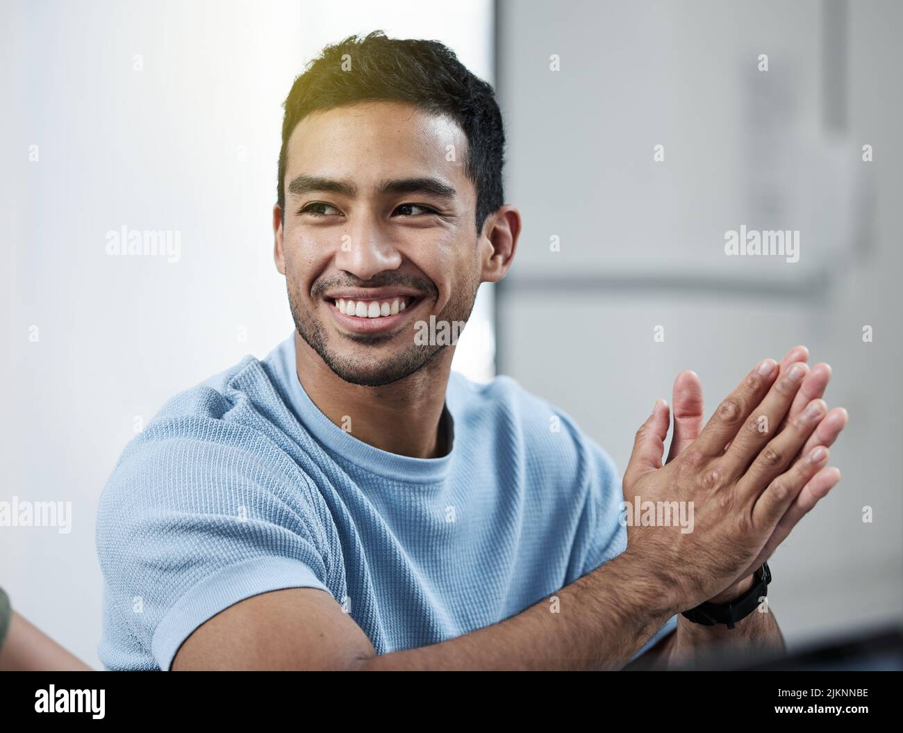 Another successful day at the office. a young businessman giving a ...