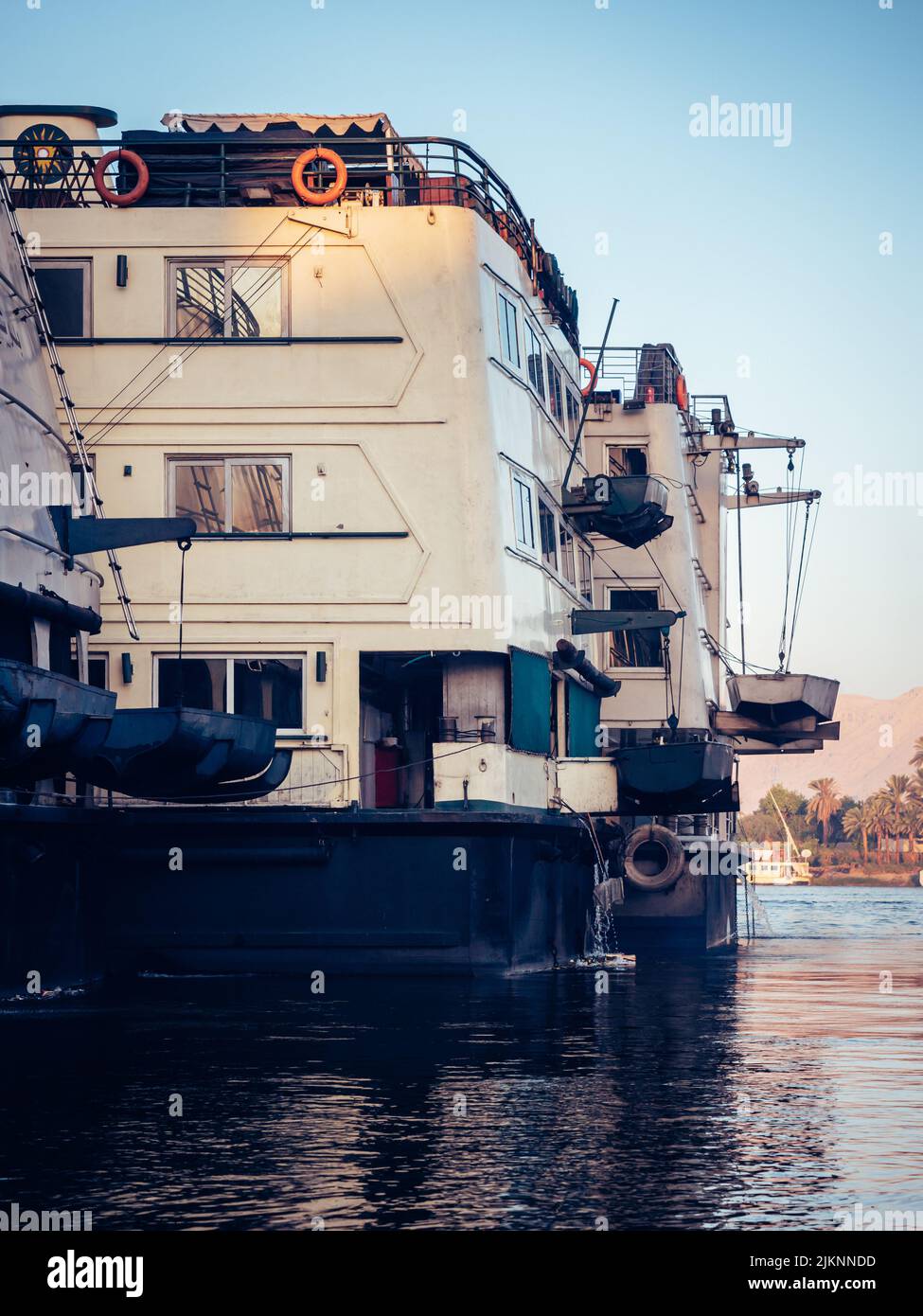 A vertical shot of a big white ship gliding on the sea in Egypt Stock ...
