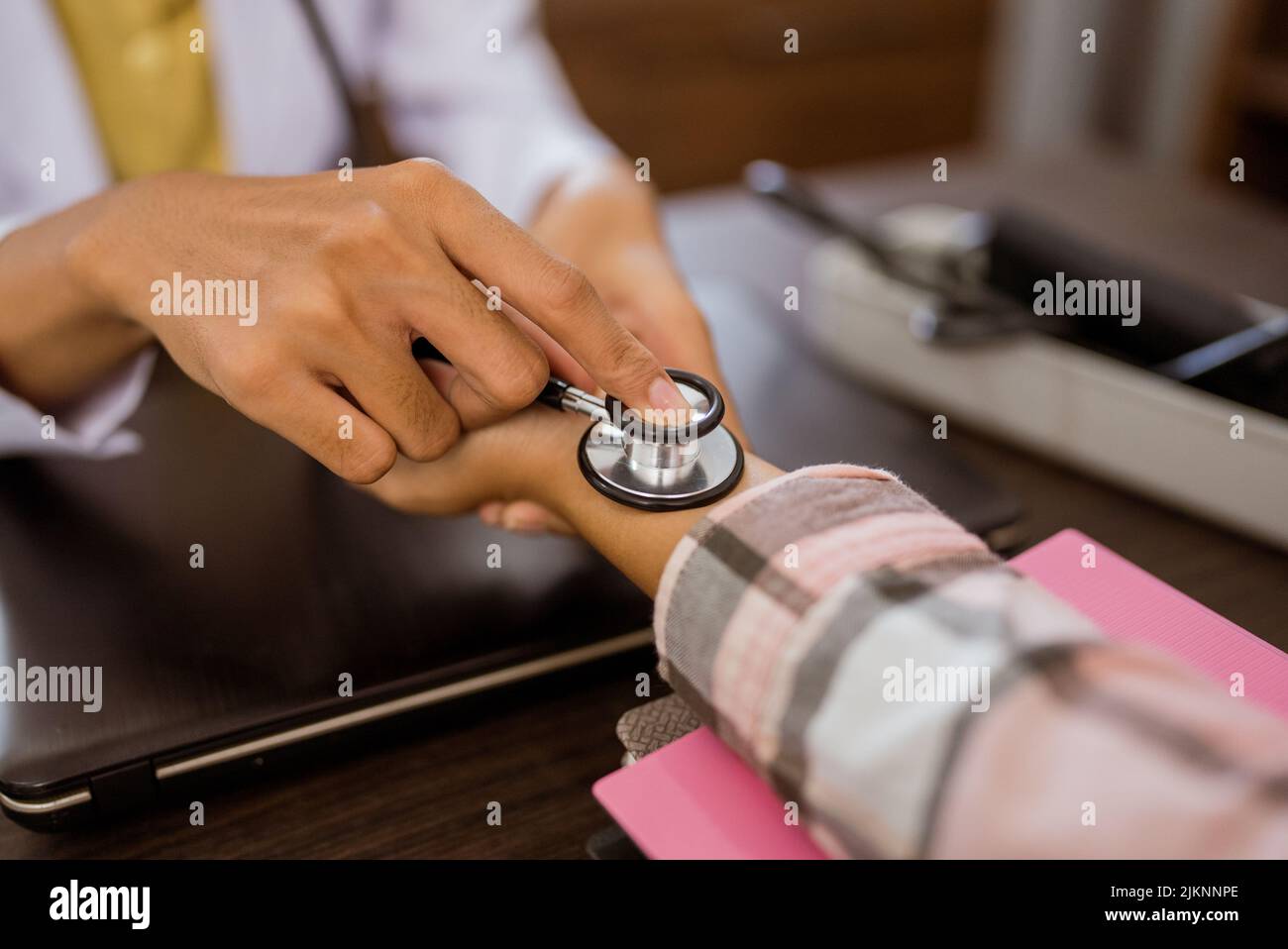 close up of doctor's hand with stethoscope checking heart rate Stock ...