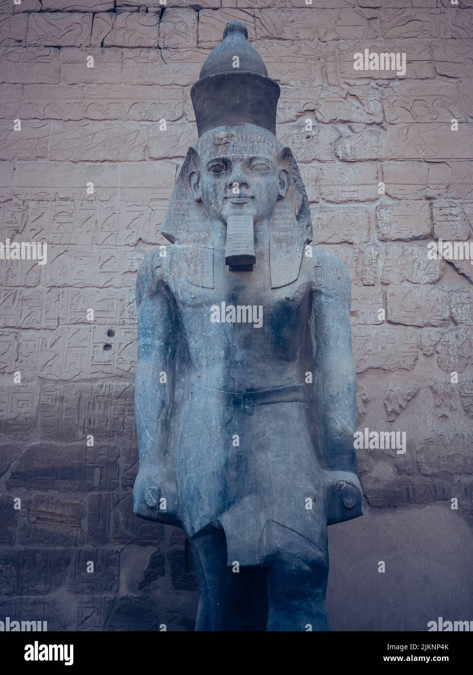 A vertical shot of an ancient pharaoh statue in Karnak Temple, Luxor ...