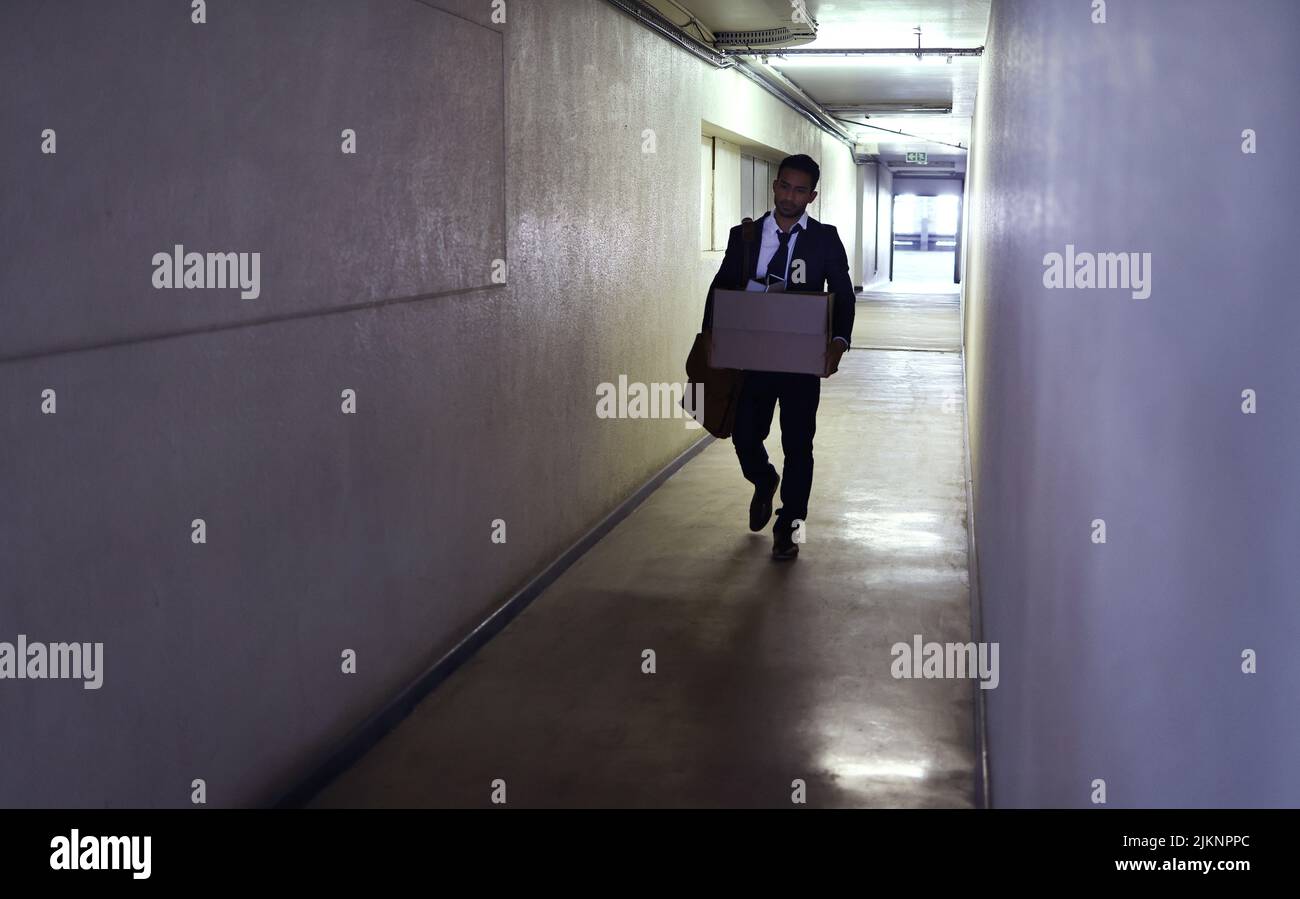 Retrenchment is real. Full length shot of a handsome young businessman ...