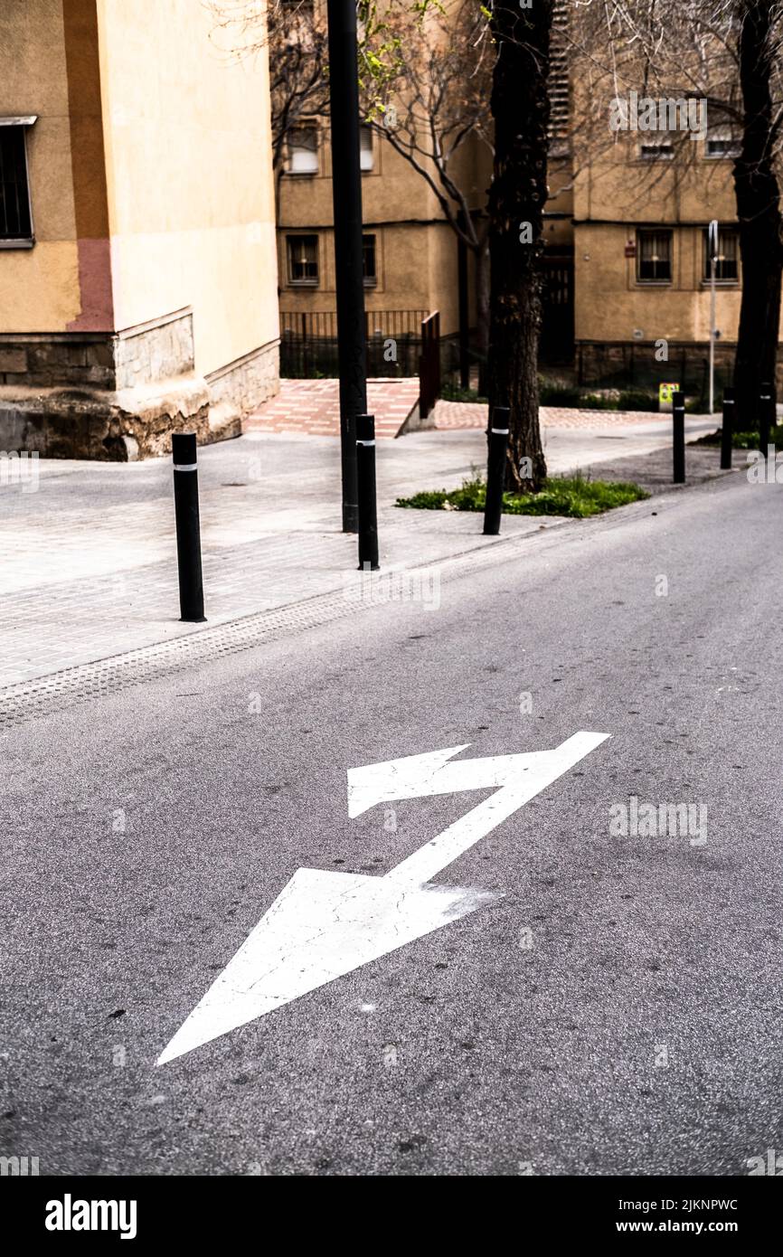 traffic sign with an arrow in a street Stock Photo - Alamy